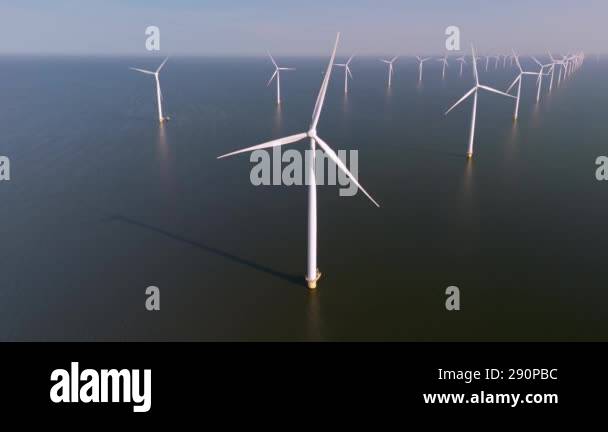 Discover a breathtaking array of windmill turbines gracefully rising ...