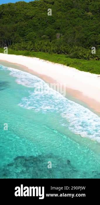 Experience the breathtaking beauty of La Digue Seychelles with its soft, white sand beaches and ...