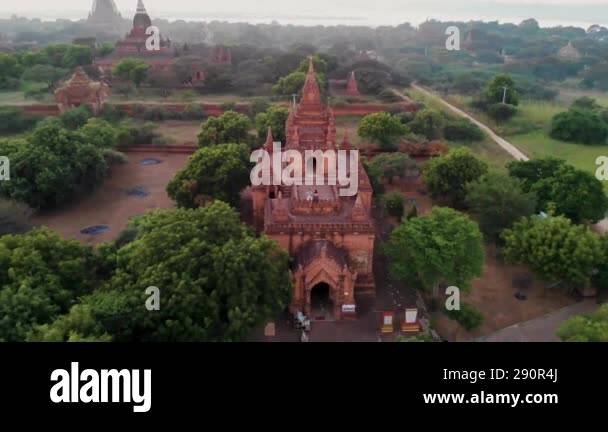 As the sun rises, the breathtaking temples of Bagan Myanmar emerge from ...