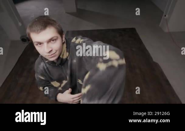 Handheld top view shot of confident Caucasian male zoomer in streetwear ...