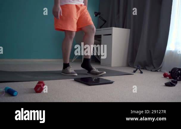Fitness, weight loss concept. Close-up of man stands on scales for fix ...