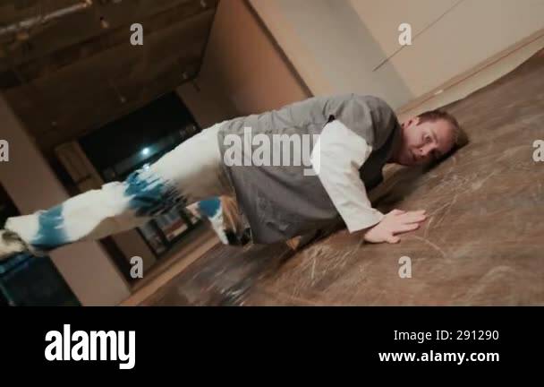 Handheld ground level shot of Caucasian male zoomer in street style ...