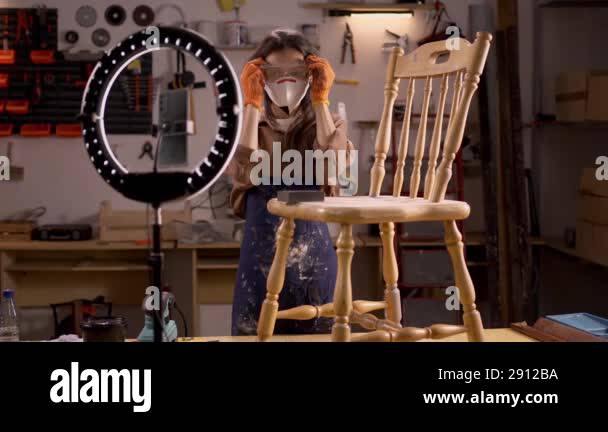 blogging, furniture restoration concept. Woman blogger with mobile ...