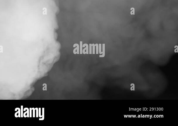 A jet of dense white smoke is blown away by a stream of air Stock Video Footage - Alamy