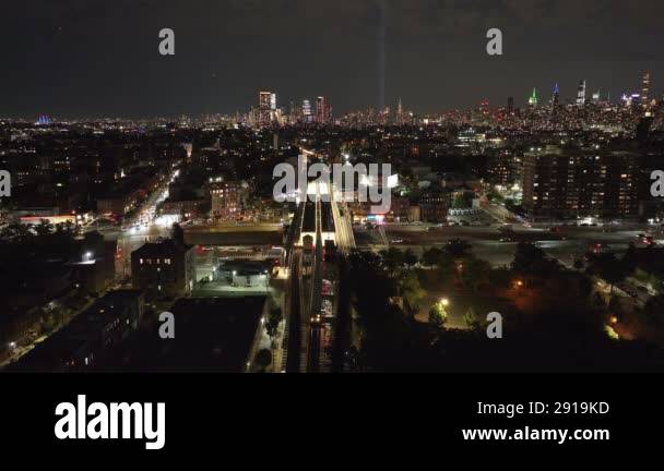 Aerial view of the New York City subway in Queens at night. Shot in ...