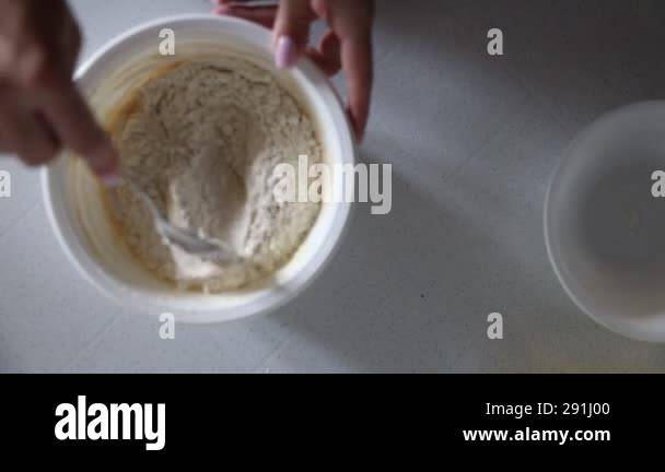 Manis is kneading dough, preparing delicious and fluffy homemade bread ...