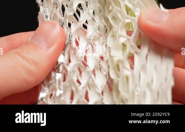 Air filter tear open macro close up. Filter inside membrane pattern ...