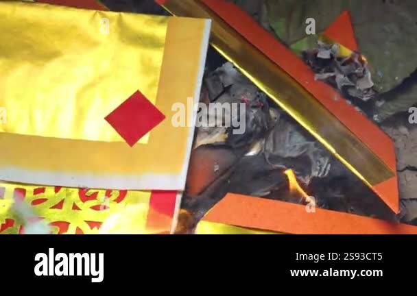 Sequential burning of joss paper in a ritual Stock Video Footage - Alamy