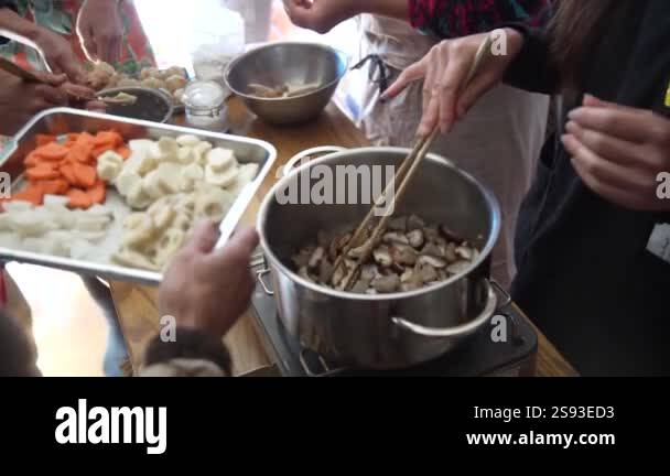 A woman making kenchinjiru soup Stock Video Footage - Alamy