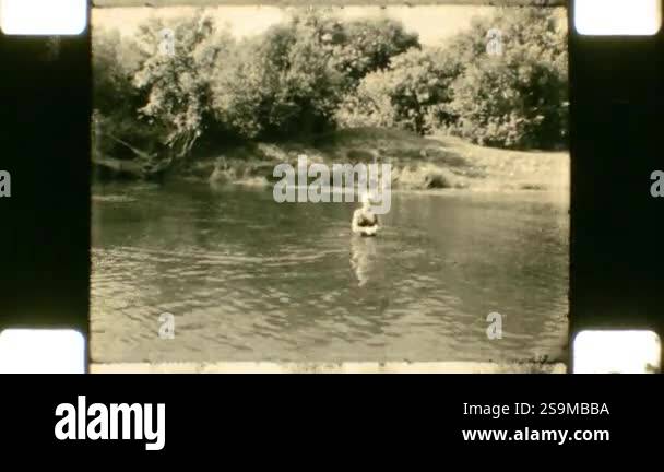 16mm film. USSR, Belarus, 1970s. people swim and relax on the banks of ...