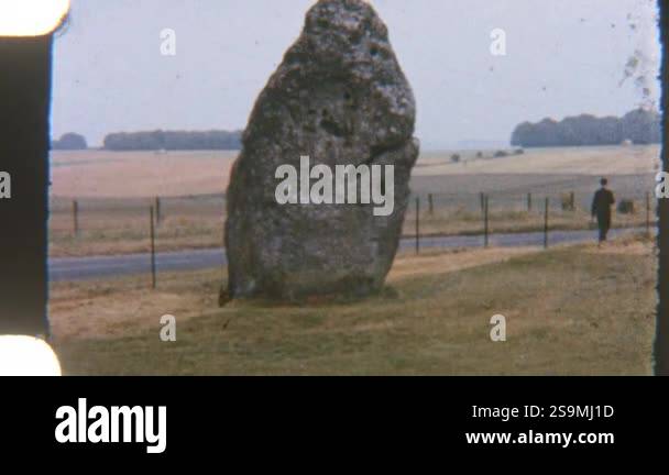 An ancient sarsen stone structure stands tall in the vast open ...
