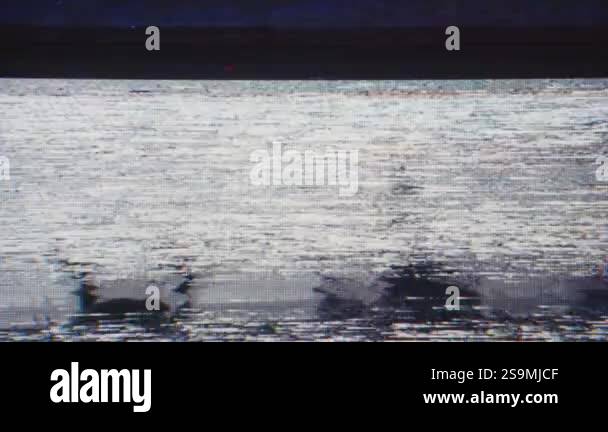 A vintage VHS tape plays back with a distorted static screen effect ...