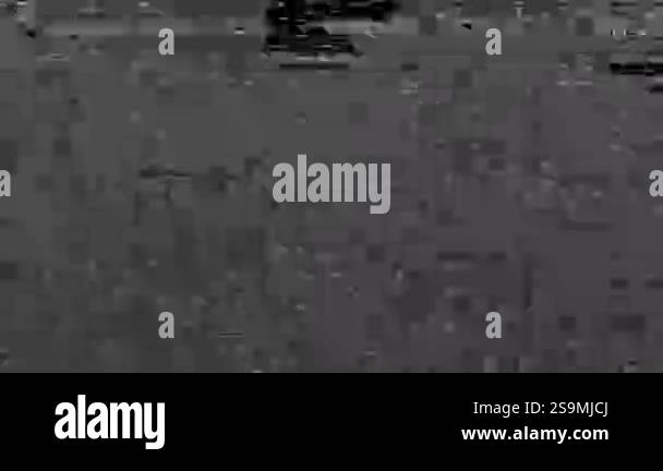 A flickering static noise from an old VHS tape with grainy visuals ...