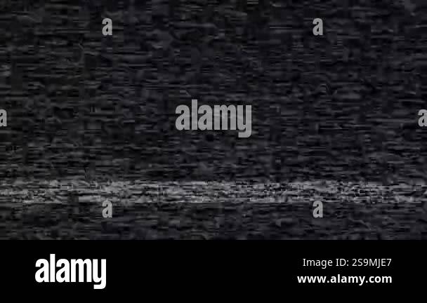 A vintage VHS playback showing static noise with glitchy disruptions ...