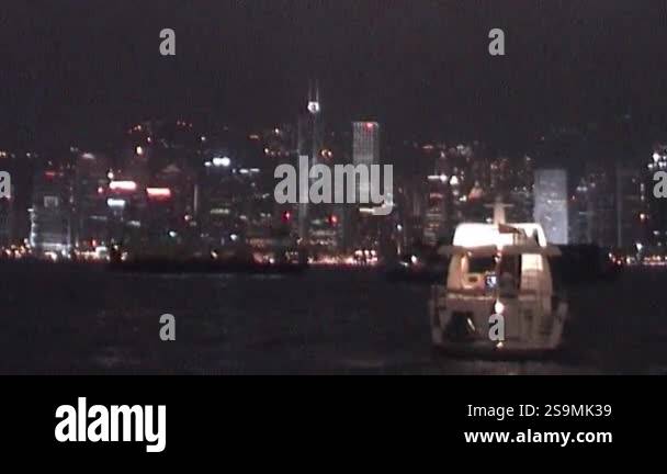 An old VHS home video captures the Hong Kong skyline, shrouded in a ...