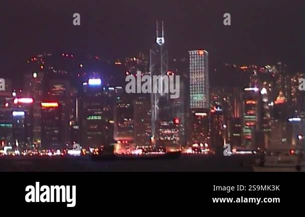 A VHS-era home video recording captures high-rise building with retro ...