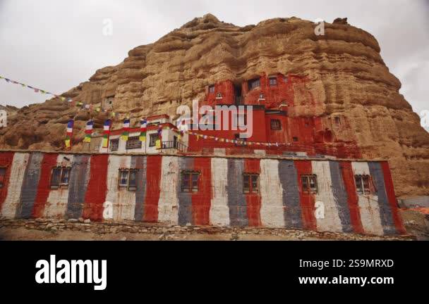 Nestled within the rocky cliff of Mustang, Nepal, the sacred Sun Cave ...