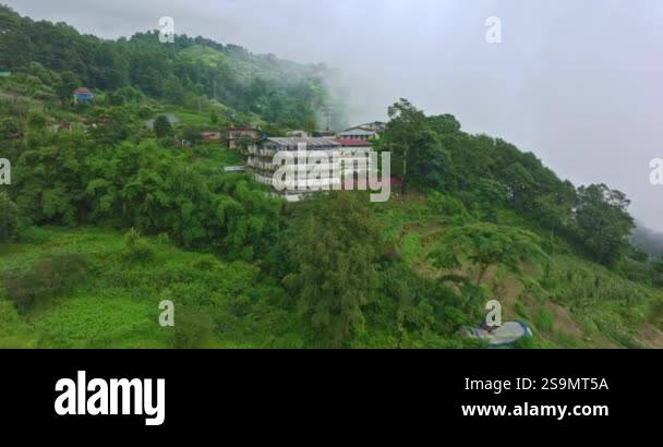Traditional houses nestled on Nepal's lush mountain landscape ...