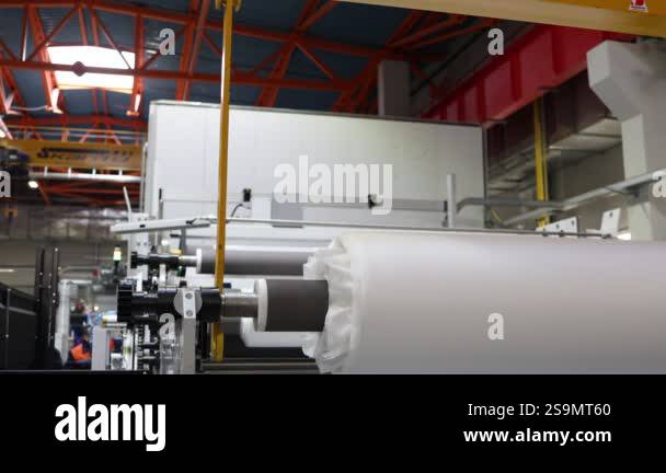 Paper roll in industrial setting showcasing large machinery and ...