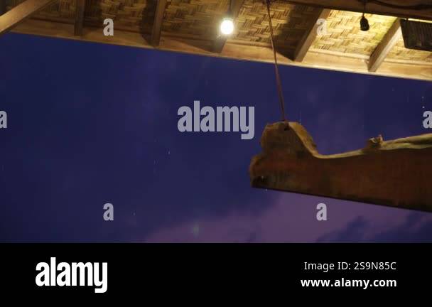 slow motion Ambient Scene of Wooden Roof With Simple Lighting During ...