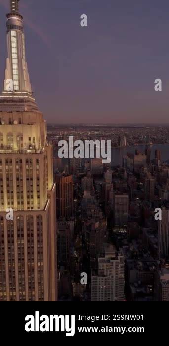Camera panning up the Empire State Building in Midtown Manhattan at ...