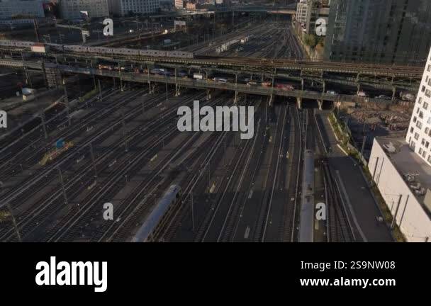 Railroad trains traversing bustling Sunnyside Yard, industrial ...