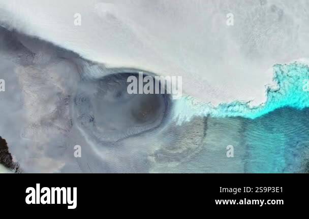 Two rivers meet without mixing in Iceland, clear water and muddy water ...