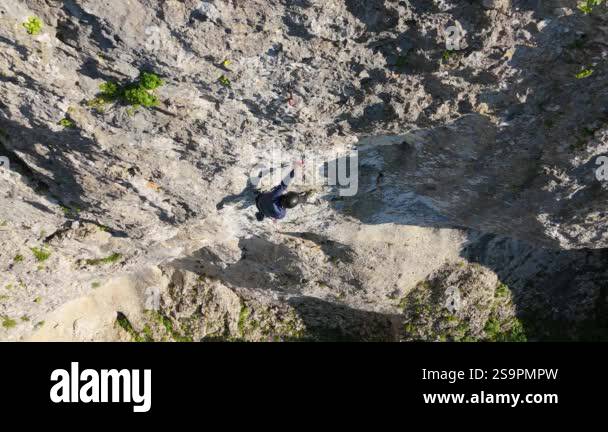 Lead Climbing. Rock Climber on Overhanging Wall. Aerial Overhead Drone ...