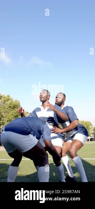 Vertical video: Rugby players lifting teammate reaching for ball during ...