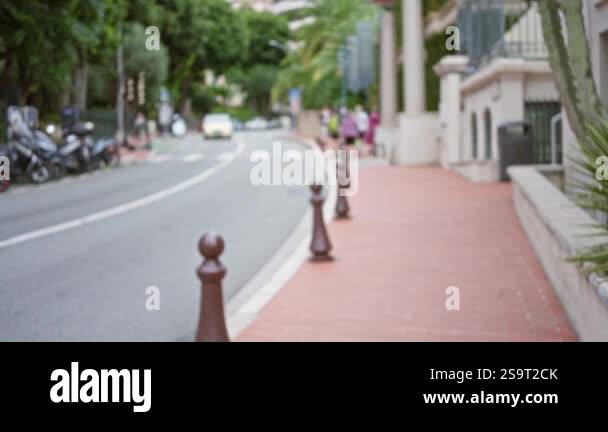Blurry outdoor street scene in monaco with defocused view of luxury ...