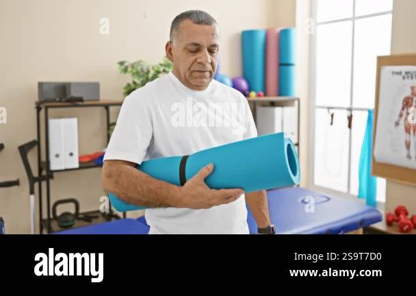 Man holding blue mat Stock Videos & Footage - HD and 4K Video Clips - Alamy