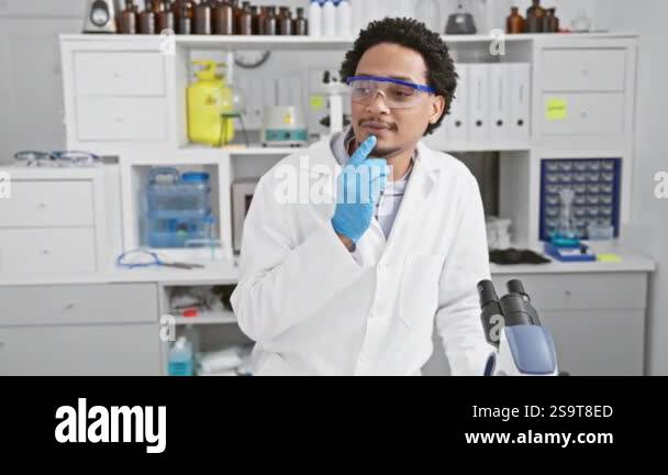 Cheerful young african american scientist with crossed arms, proudly ...