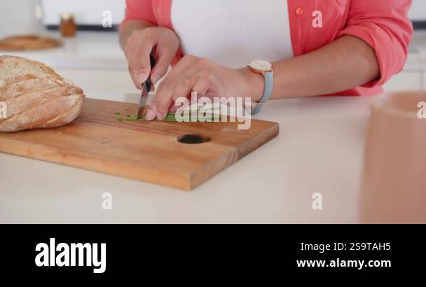 Chopping fresh herbs on cutting board, asian woman preparing ...