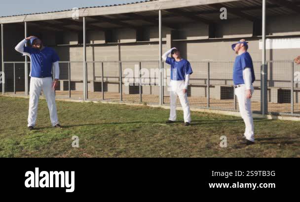 Baseball players stretching and warming up on field before game. Sports ...