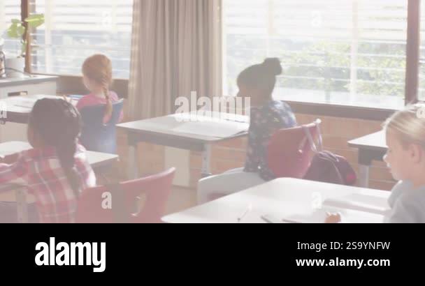 Teaching in classroom, female teacher engaging with students in school ...