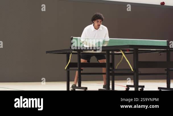 Watching table tennis game, group of people standing and cheering in ...