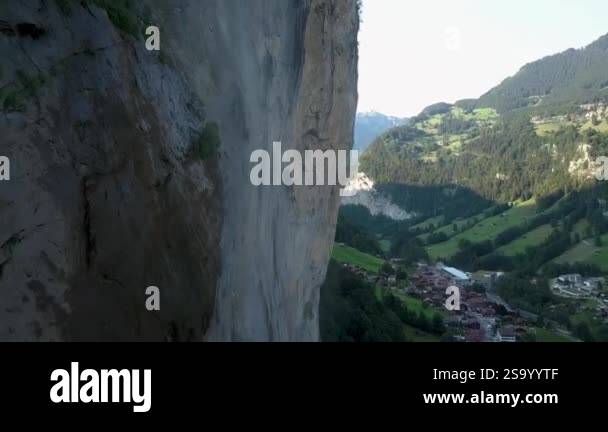Drone Vertical Descent Tracking Waterfall Over Majestic Cliff at ...