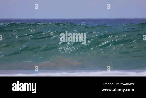 Slow motion footage of powerful ocean waves crashing on a tropical ...