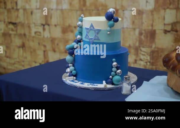 A beautifully crafted and designed blue cake that features the elegant ...