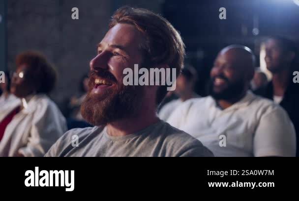 Man with a broad smile in congregation during worship, joyful ...