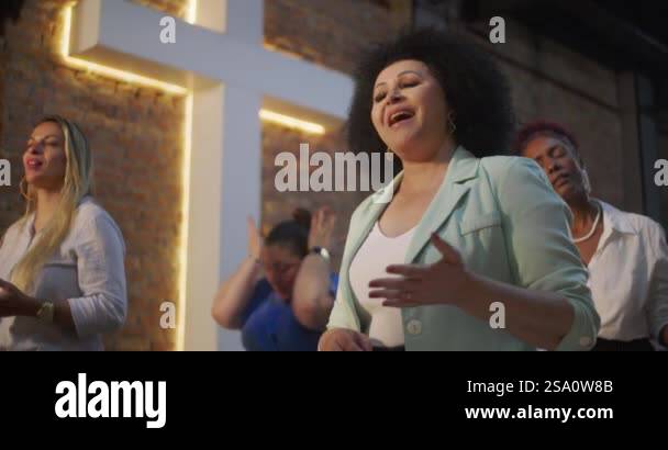 Emotional woman immersed in spiritual worship, eyes closed in heartfelt ...