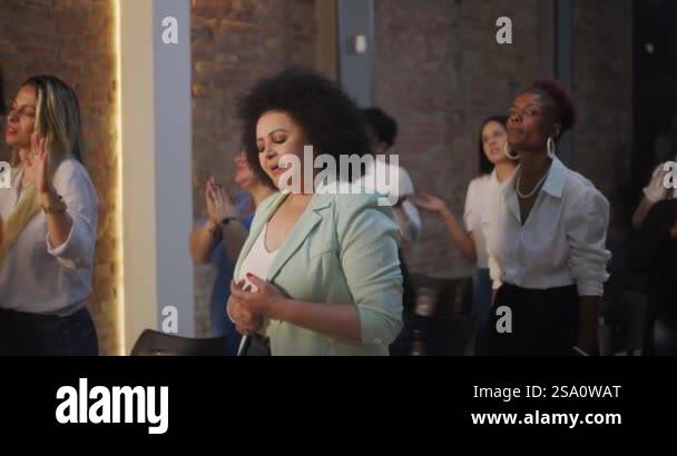Woman with eyes closed in prayer during a spiritual gathering in a ...