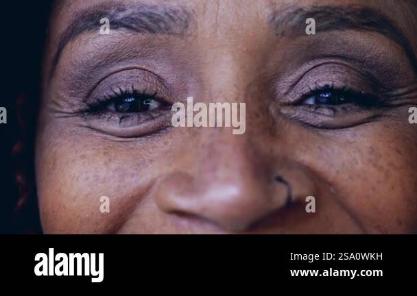 One happy middle-aged 50s woman macro close-up smiling at camera with ...