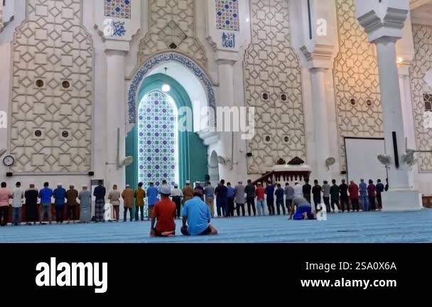 KUANTAN, PAHANG, MALAYSIA : JUNE 8, 2024 : Muslims pray in rukuk (bow ...