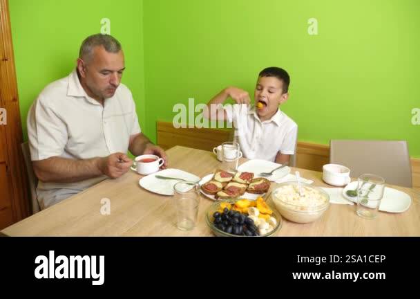 Doctors analyze an MRI image of the Father and son have dinner at the ...