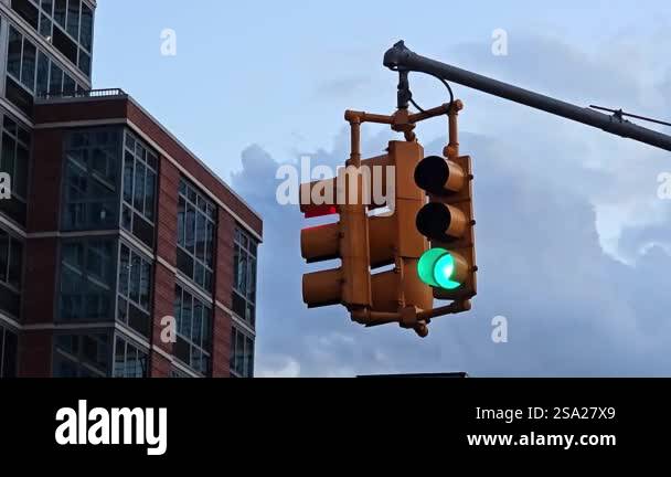 Traffic Light and Building, A green traffic light with a modern ...