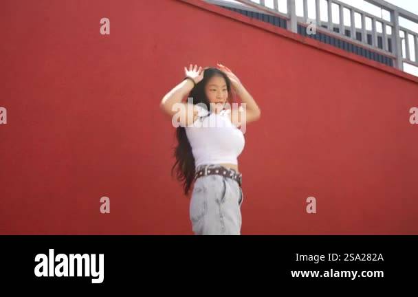 Frontal portrait with motion and three quarter length of a young happy ...