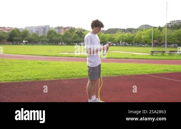 Full length video of a young caucasian man jumping skipping rope to ...