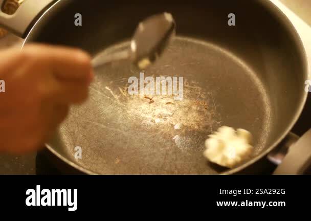 Cooking with butter in a pan Stock Video Footage - Alamy