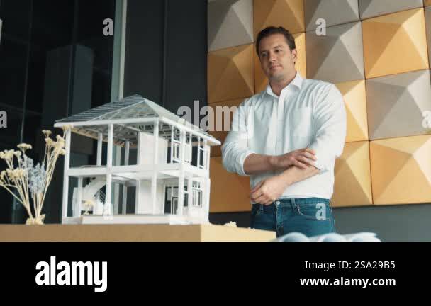 Professional smiling confident architect engineer looking at camera ...